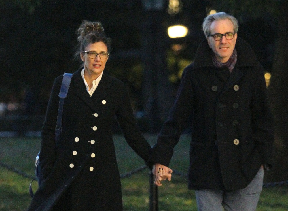 Daniel Day-Lewis and his wife Rebecca Miller walk arm in arm and hold ...
